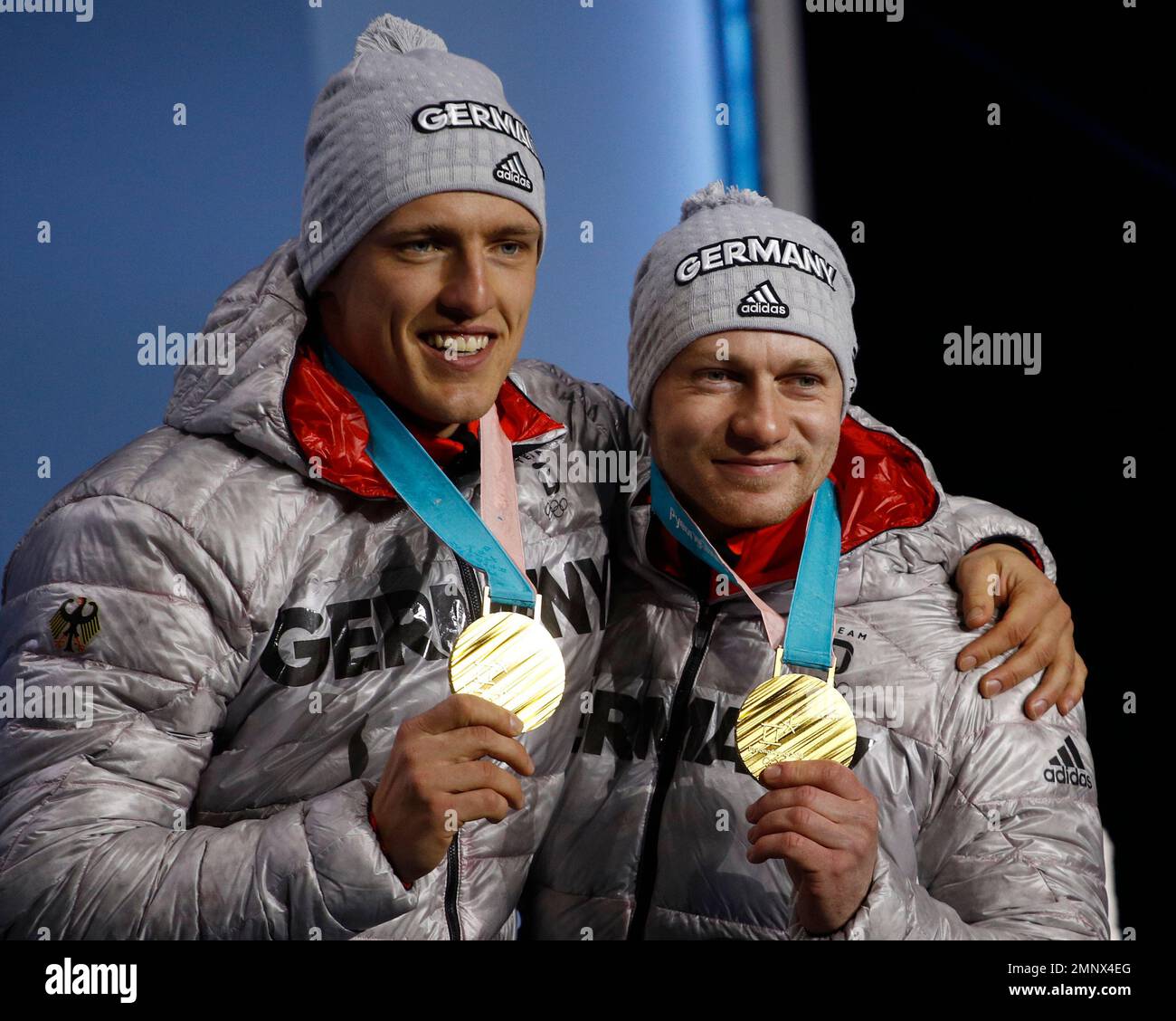 Gold medalists in the two-man bobsled Thorsten Margis, left, and ...