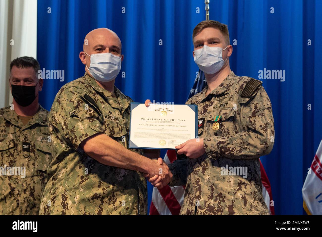 Mass Communication Specialist 2nd Class Brett Walker receives his Navy ...