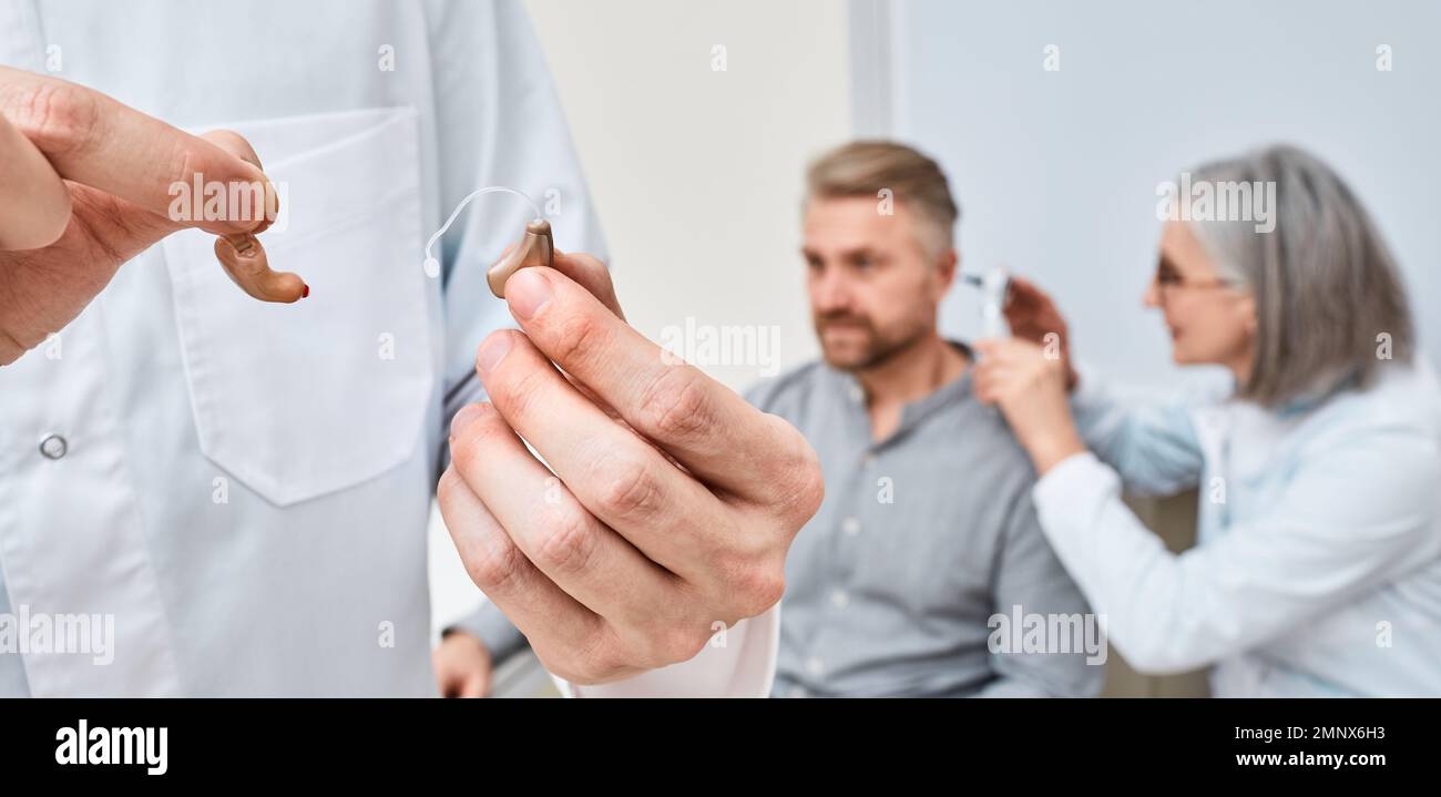 Audioprosthetis after hearing check-up for hearing-impaired patient ...