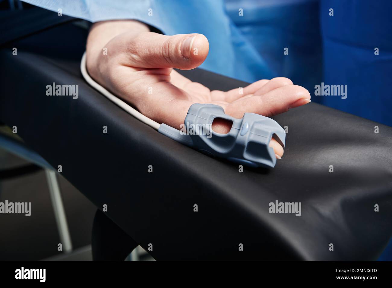 Pulse oximeter on patient's finger for detection of oxygen saturation ...