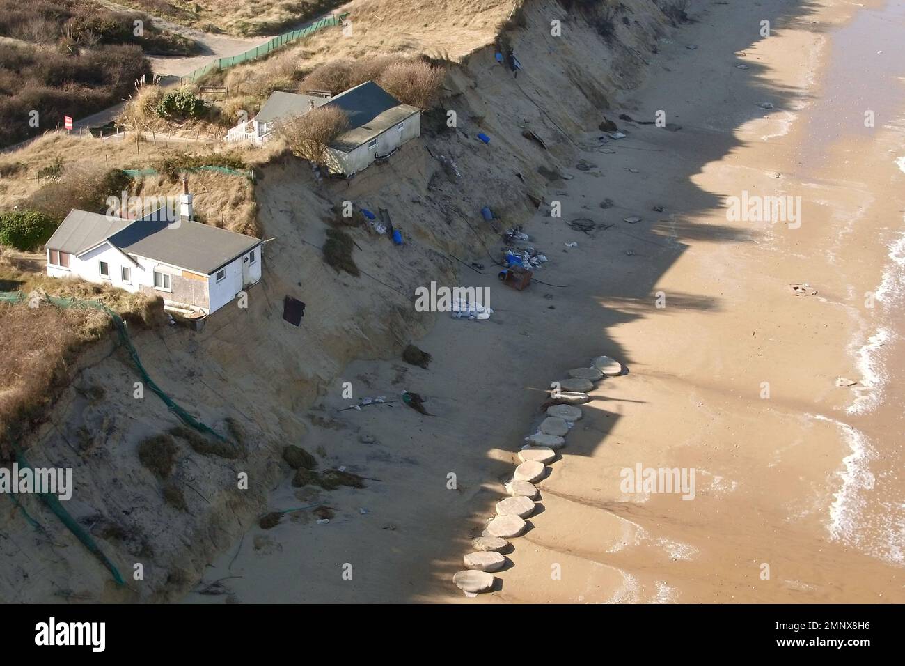 File photo dated 19/3/2018 of houses sit on the cliff edge on The ...