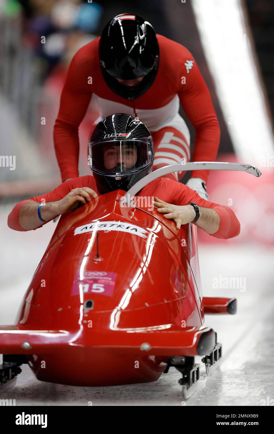 Driver Benjamin Maier and Markus Sammer of Austria start their third heat during the two-man ...