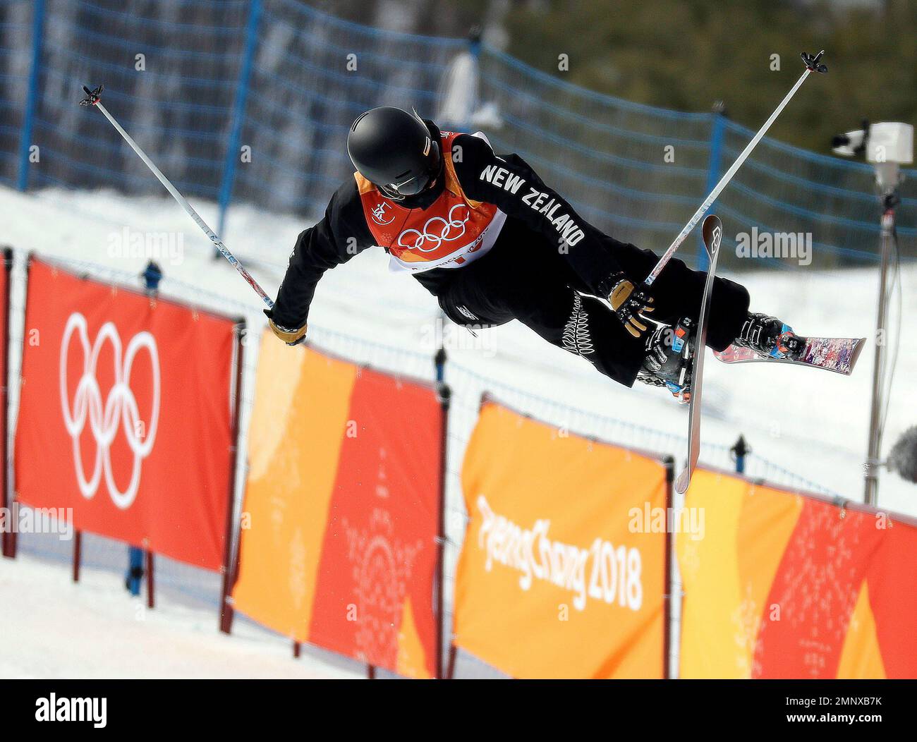 Britt Hawes, of New Zealand, jumps during the women's halfpipe ...