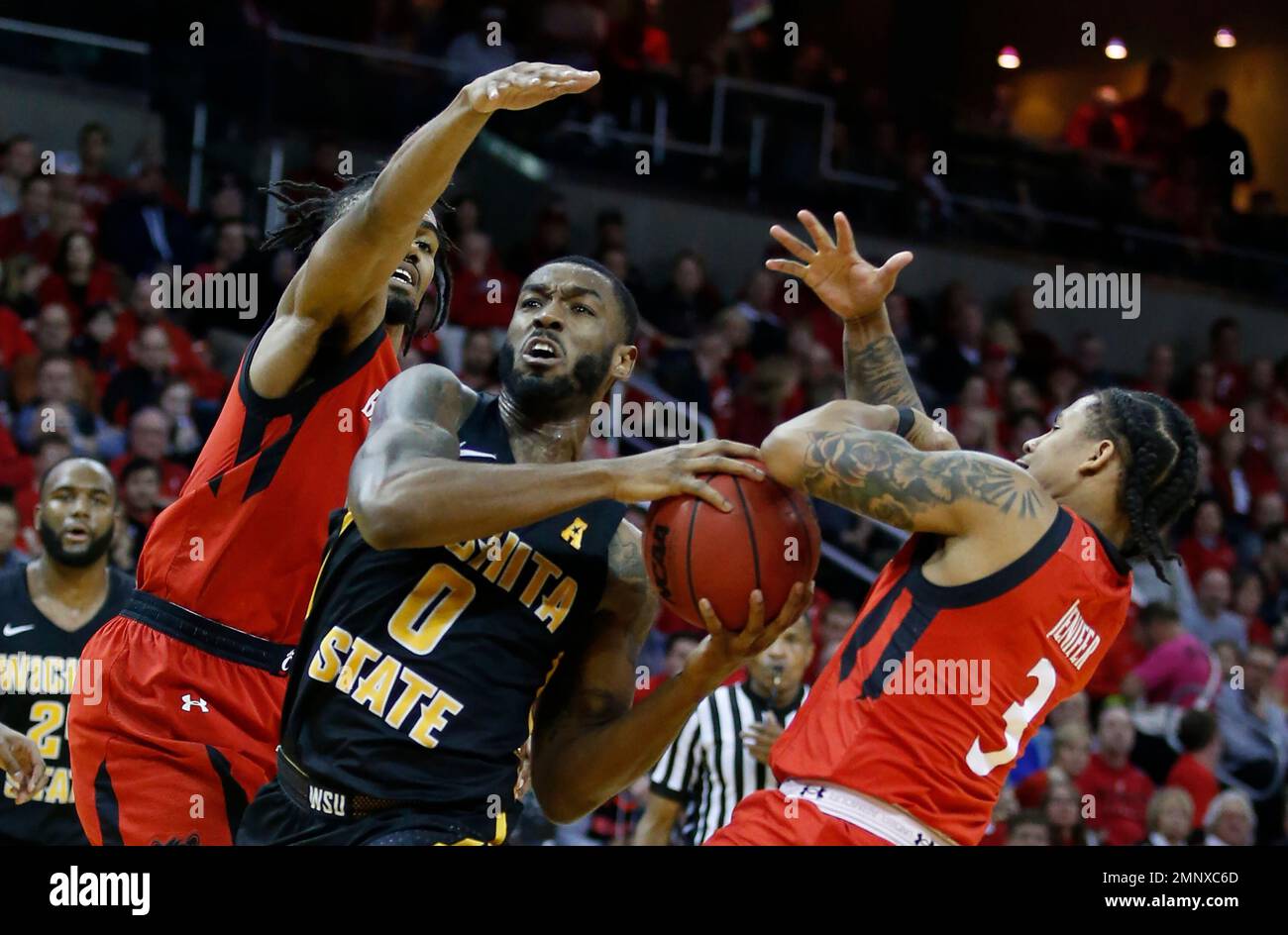 Wichita State forward Rashard Kelly (0) drives to the basket against ...
