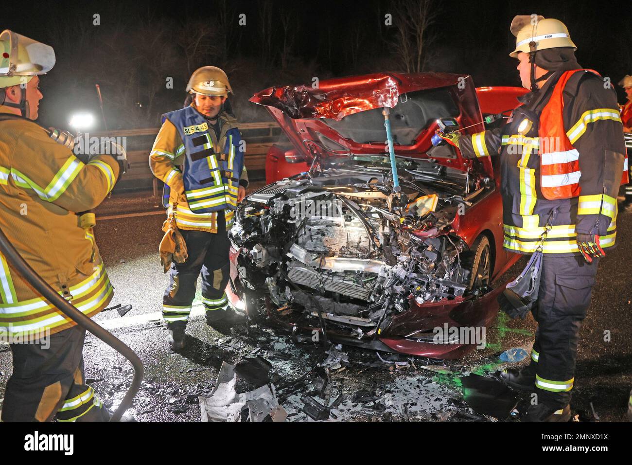 Saarlouis, Germany. 31st Jan, 2023. Firefighters stand next to a ...