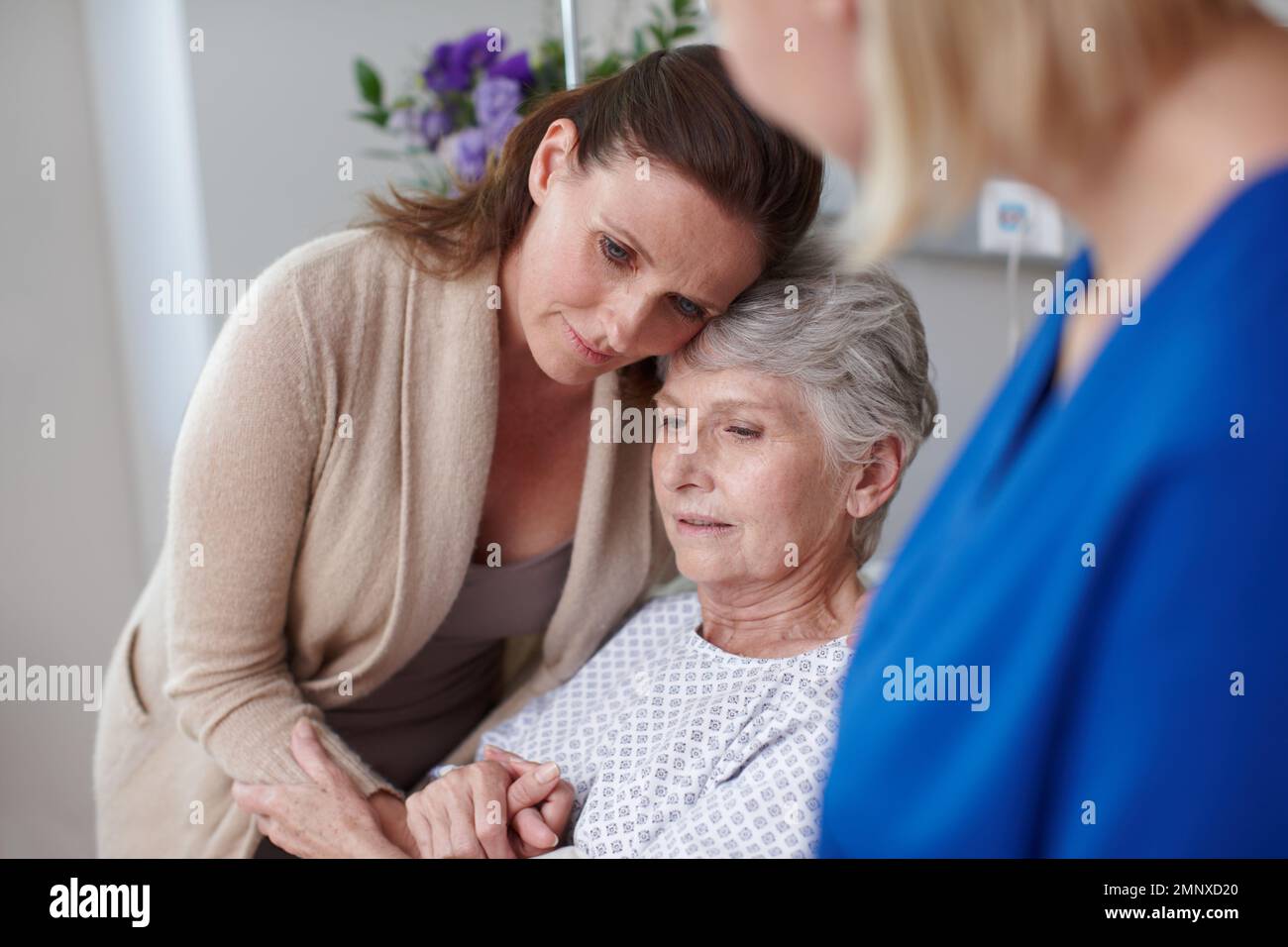 Nurse consoling relative hi-res stock photography and images - Alamy