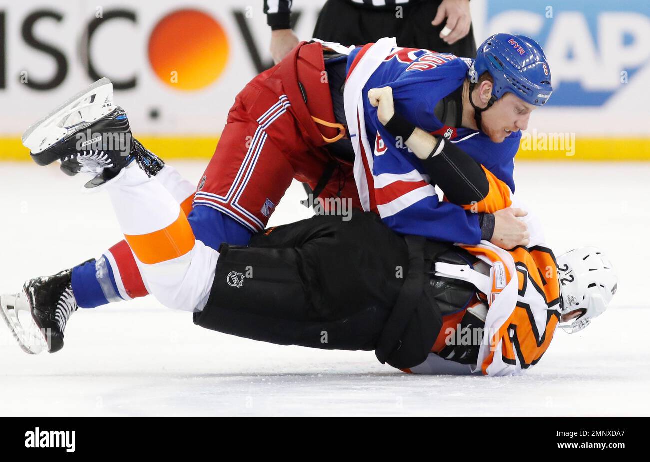 New York Rangers left wing Cody McLeod (8) fights with Philadelphia ...