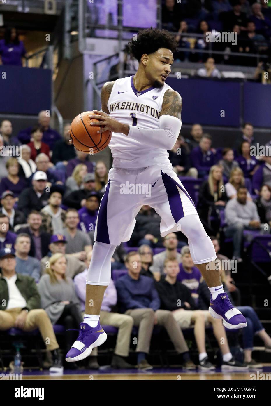 Washington's David Crisp grabs a rebound against Colorado in the second ...