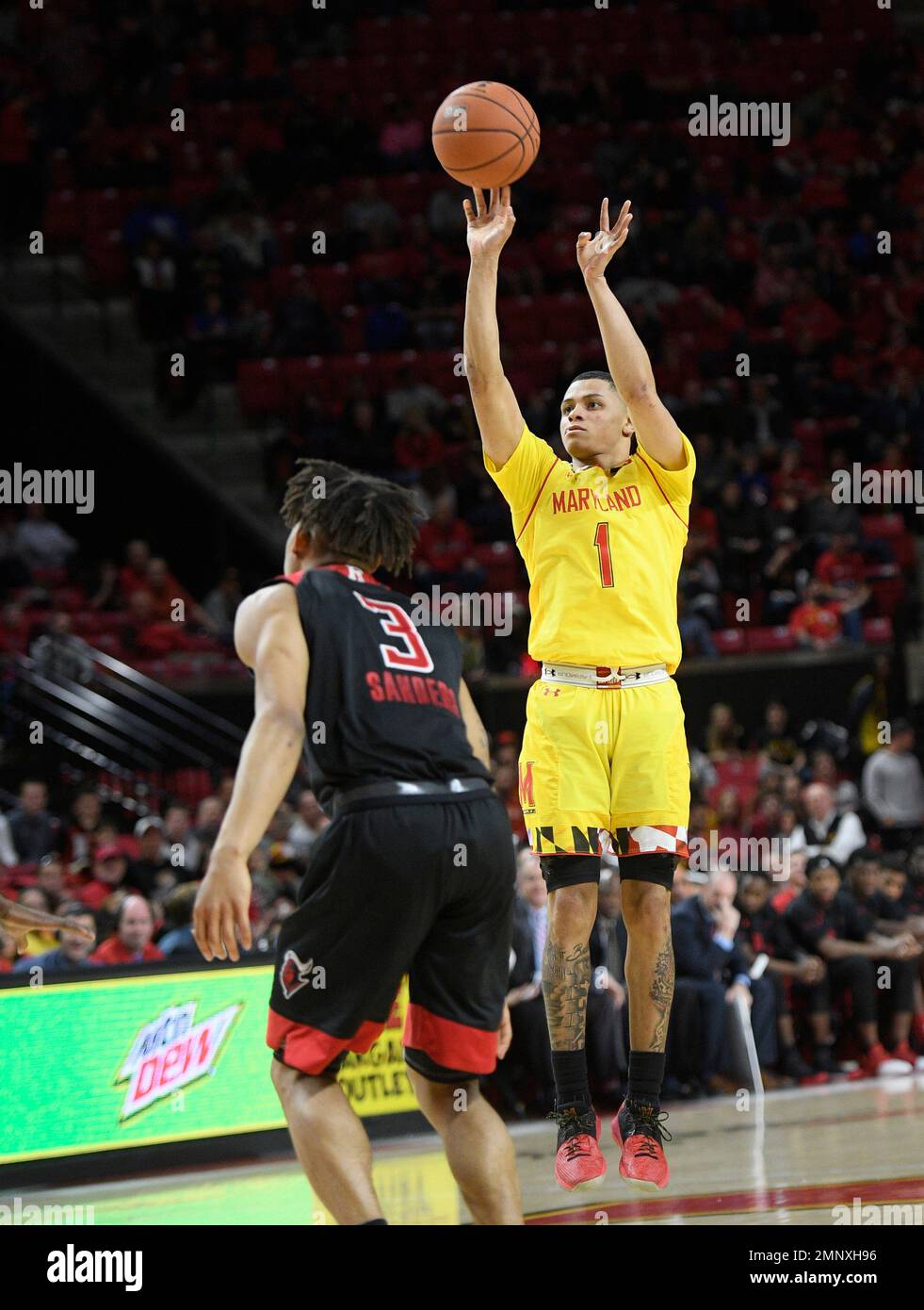 Maryland guard Anthony Cowan (1) shoots next to Rutgers guard Corey ...