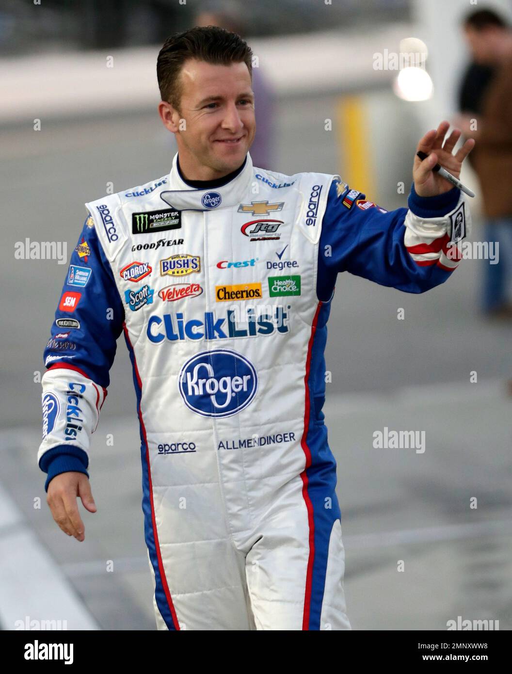 AJ Allmendinger walks down pit road before the first of two qualifying ...