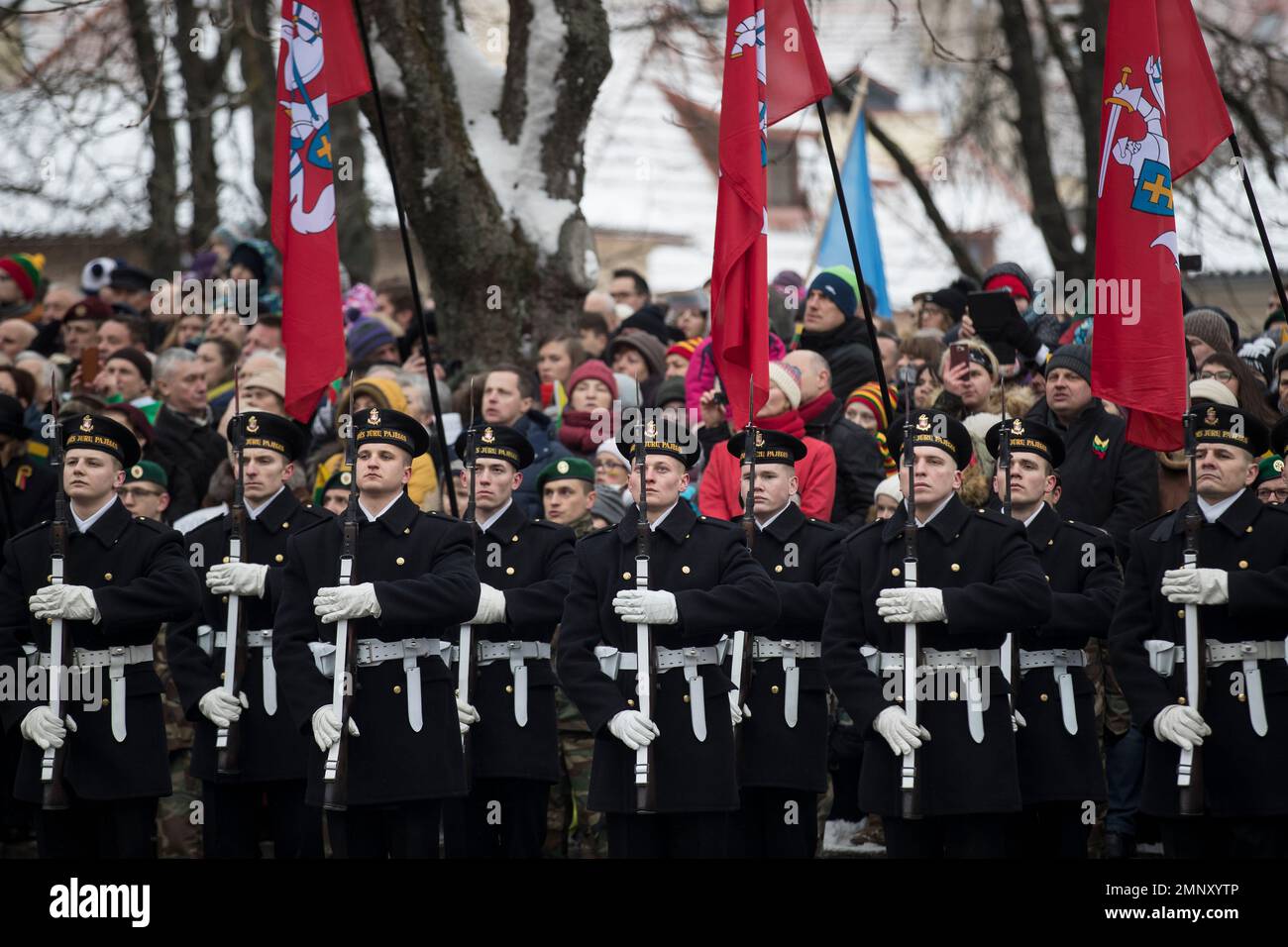 Lithuanian soldiers stand to attention during a flag-raising ceremony ...