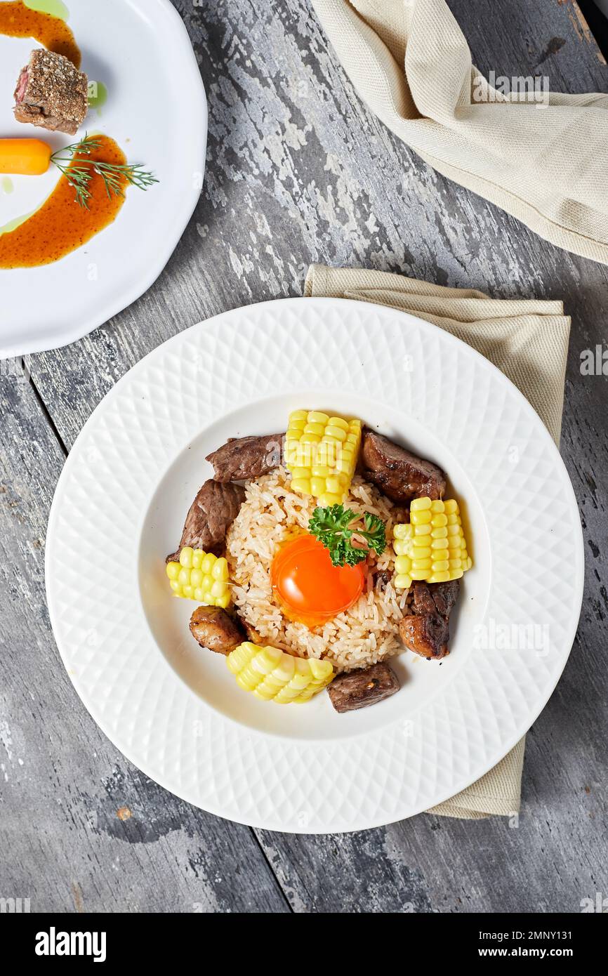 Beef fat fried rice, a dish consisting of a bowl of rice topped with ...