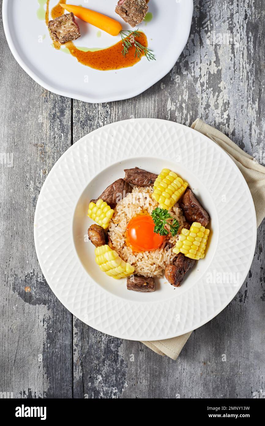 Beef fat fried rice, a dish consisting of a bowl of rice topped with ...