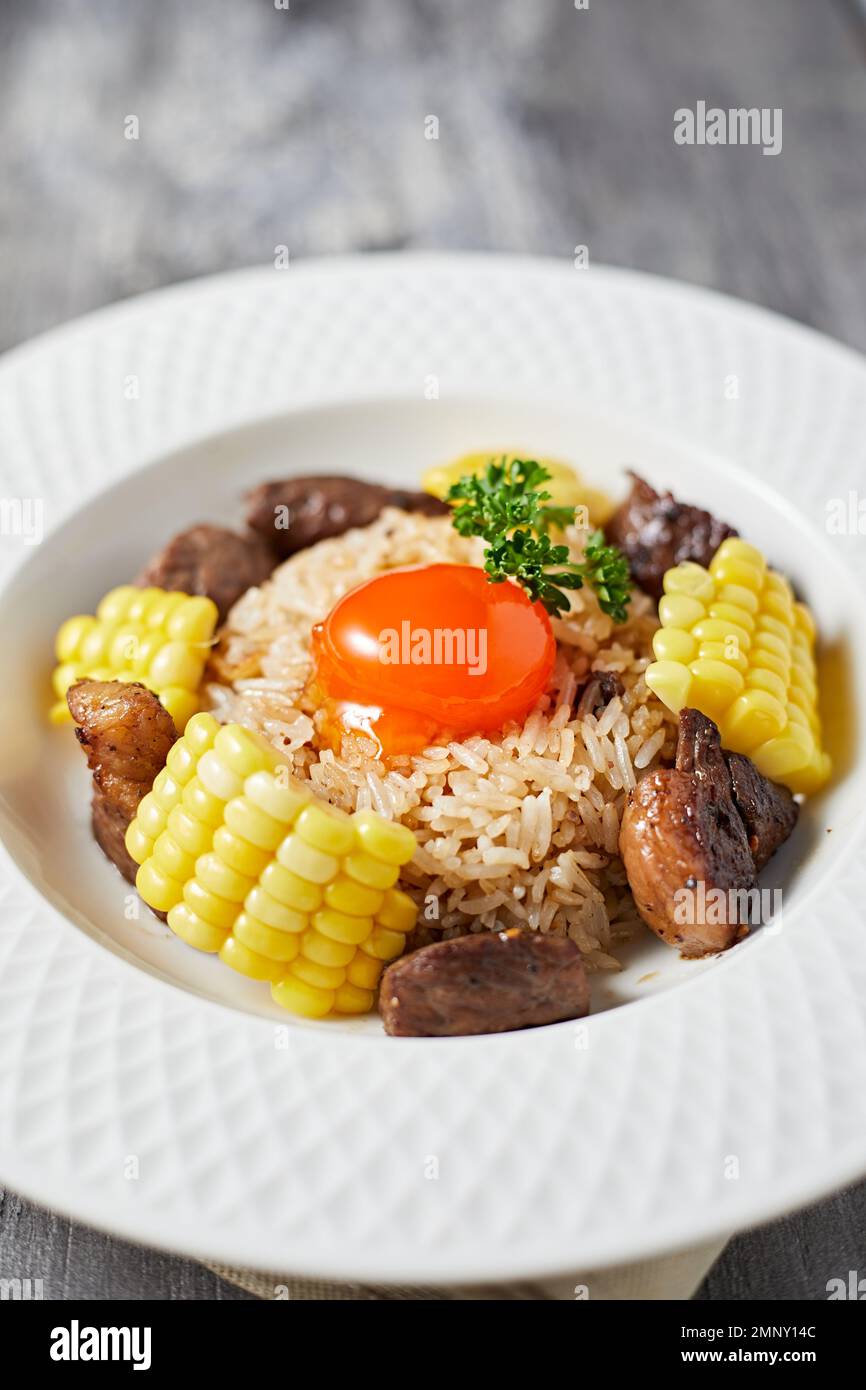Beef fat fried rice, a dish consisting of a bowl of rice topped with ...