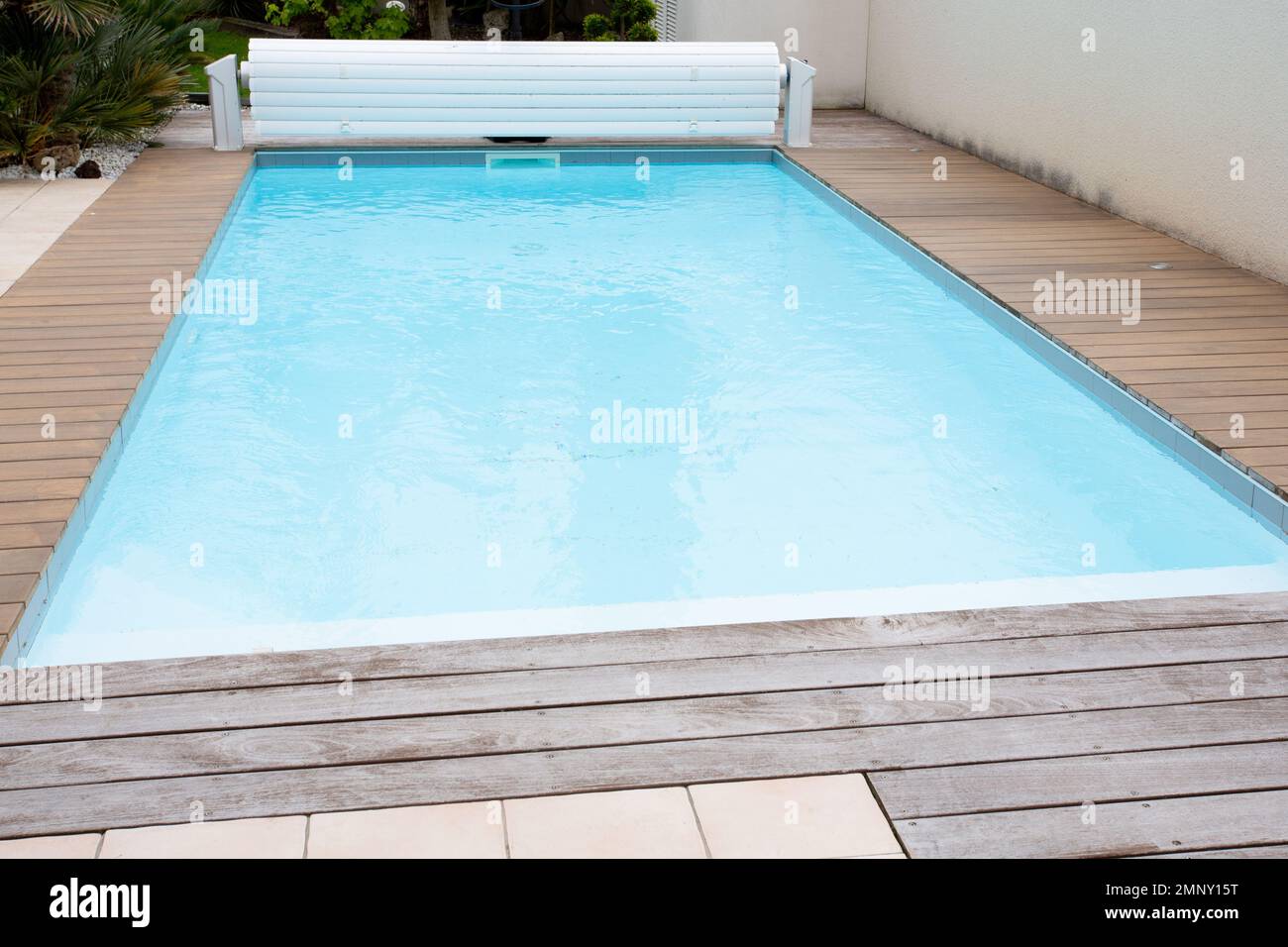 Swimming pool protected with terraced shutter rolling protection Stock ...