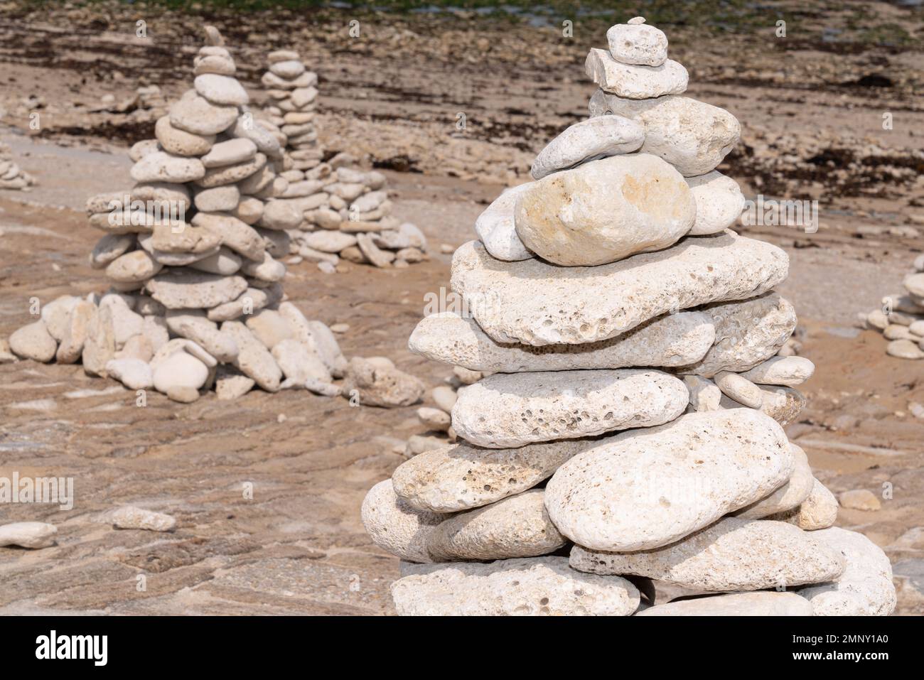 tourist pyramids zen pebble towers by the sea in a beach Stock Photo ...