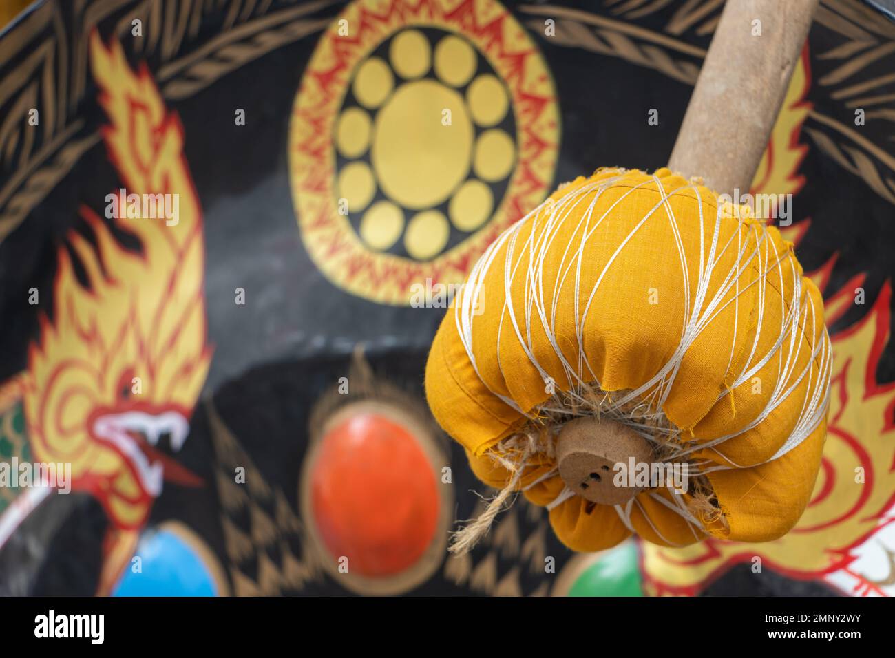 A mallet with a gong decorated with Buddhist mythology, Thailand Stock ...