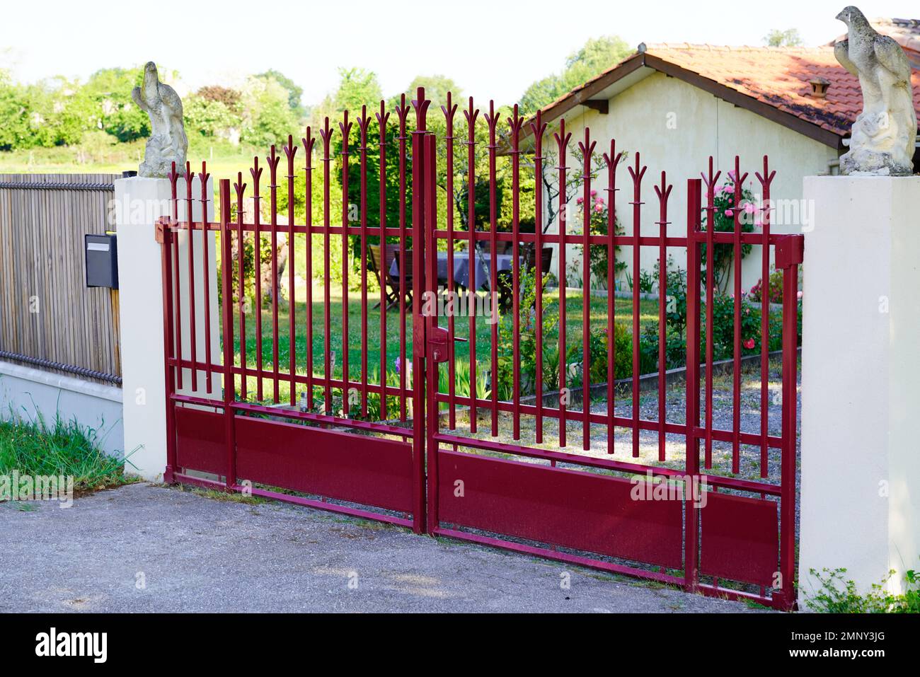 portal old red classic metal home gate at entrance of house garden door ...