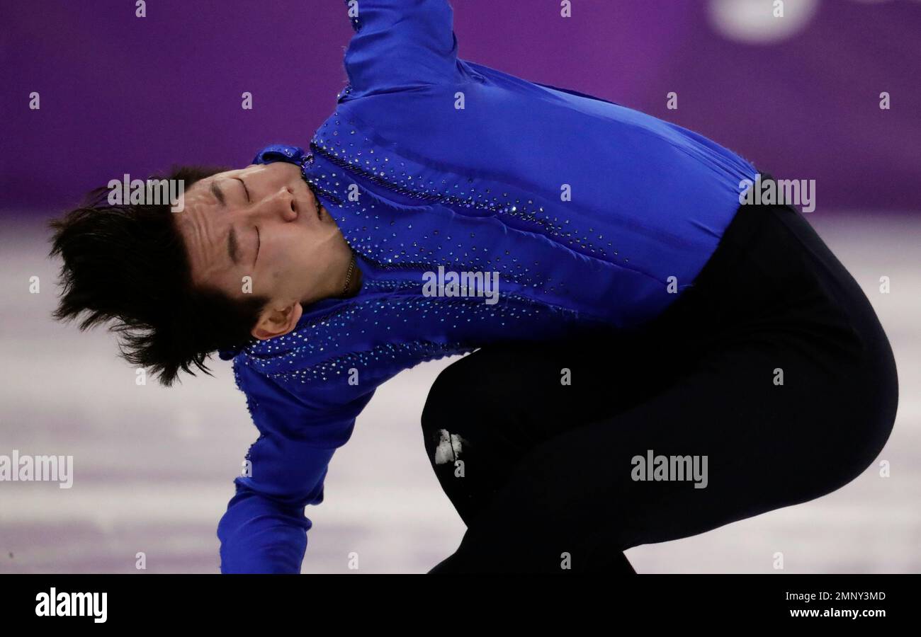 Denis Ten of Kazakhstan performs during the men's short program figure ...