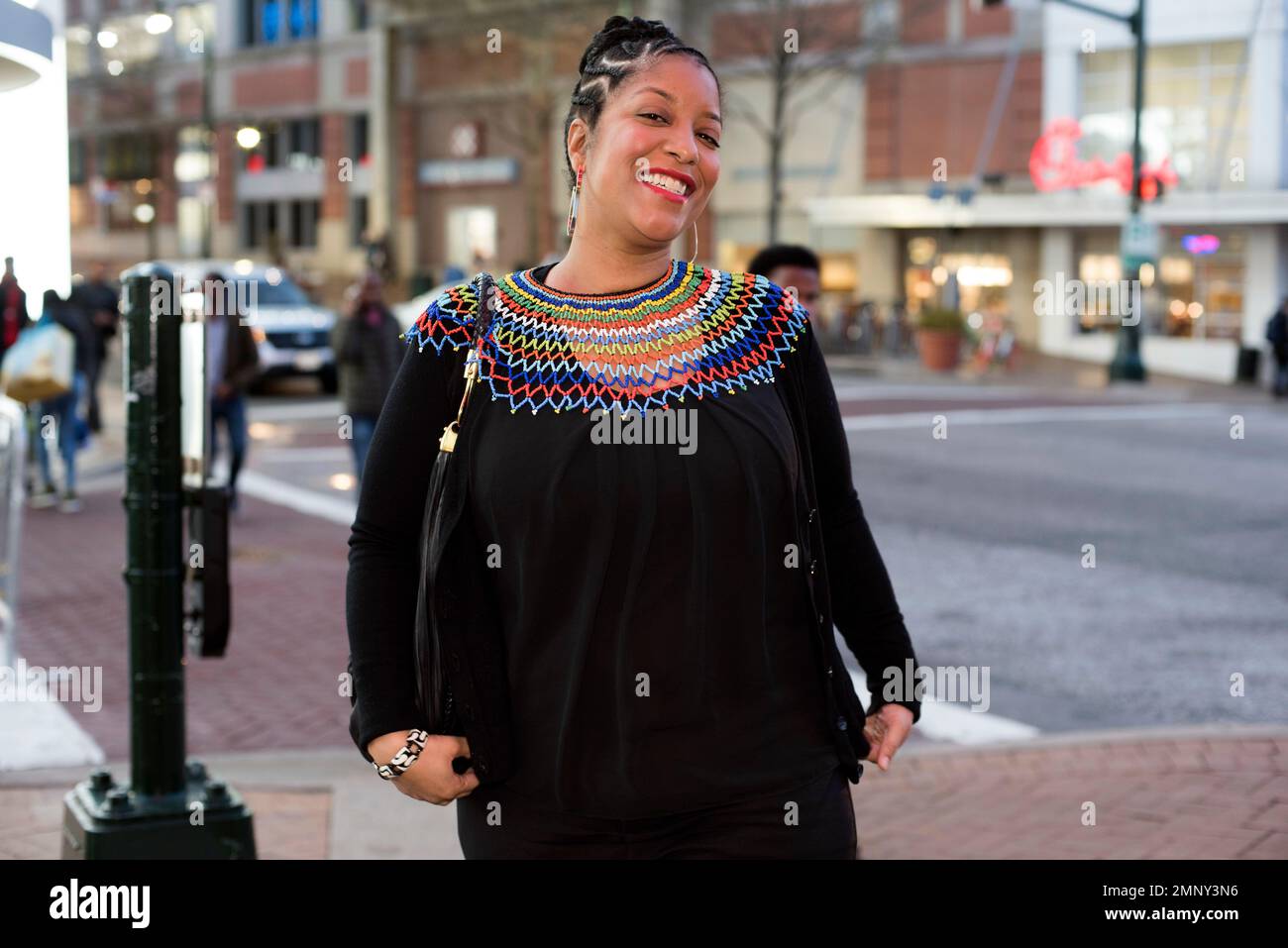 Lakeysha Thompson, dressed in Wakanda-inspired attire, poses for a ...