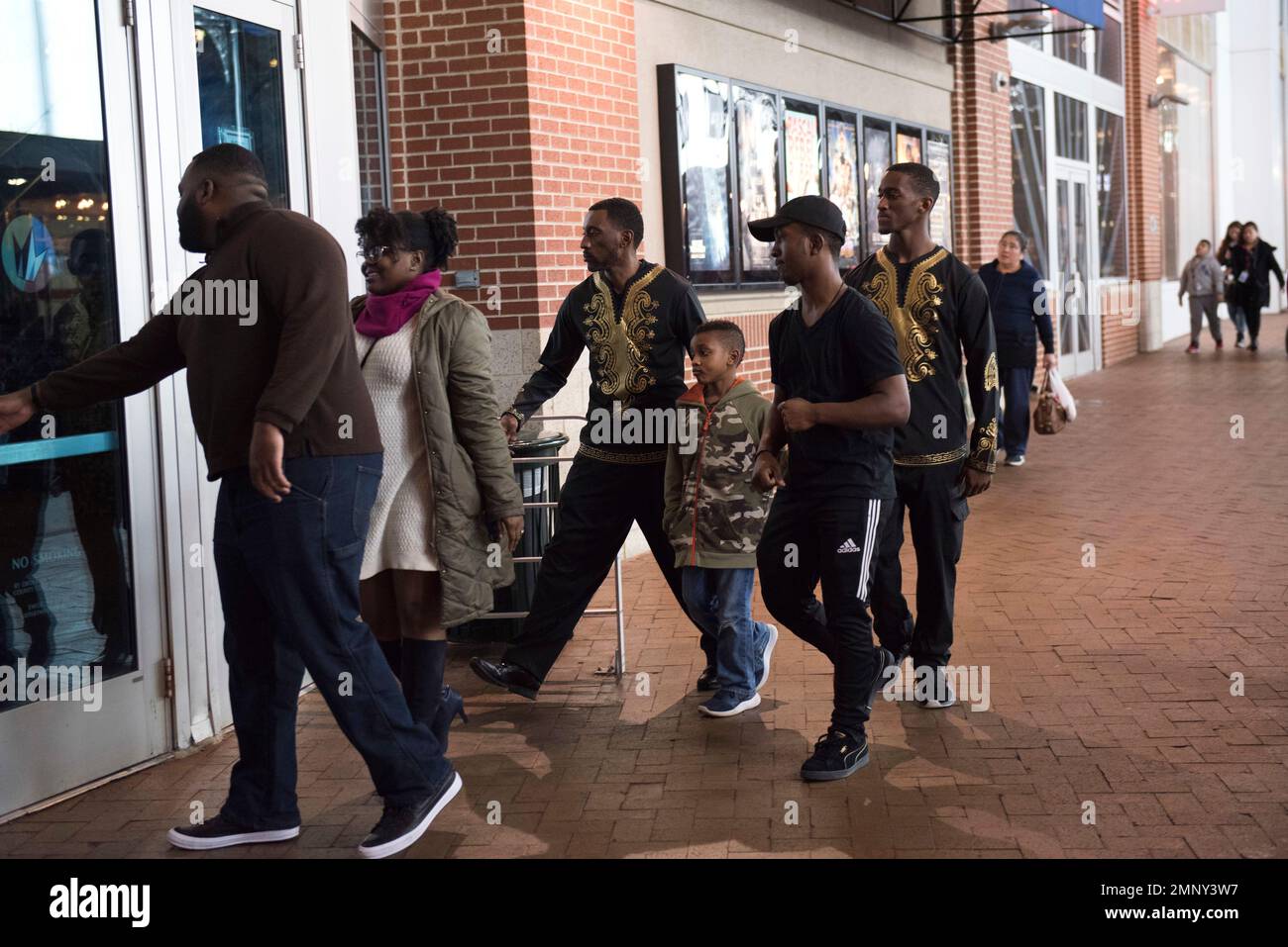 Khalel Robinson, right, arrive to see to see Black Panther with his ...