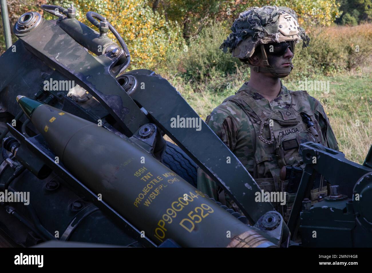 U.S. Army Pfc. John Ciluaga, a cannon crewmember assigned to Chaos ...