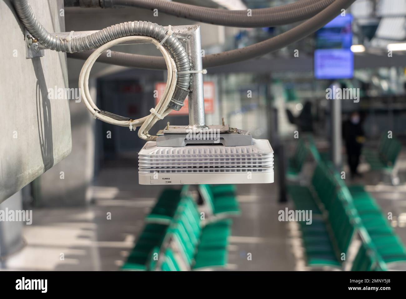 The telecommunication equipment hang on a ceiling at hall with empty ...