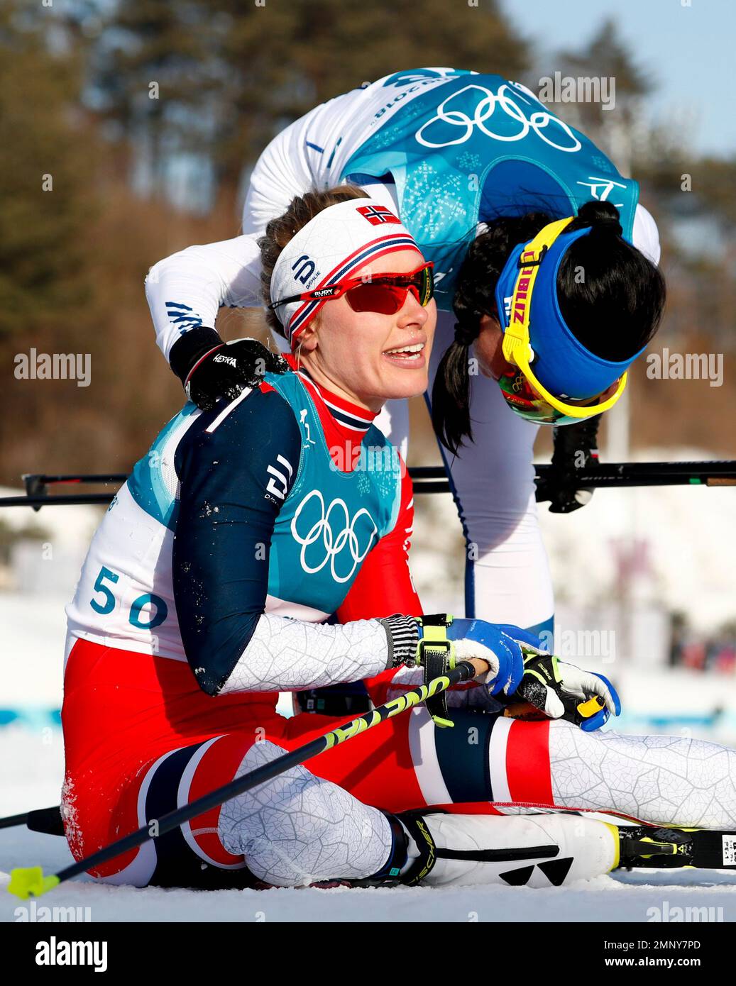Gold medal winner RagnhildHaga, of Norway, left, gets a hug from bronze ...