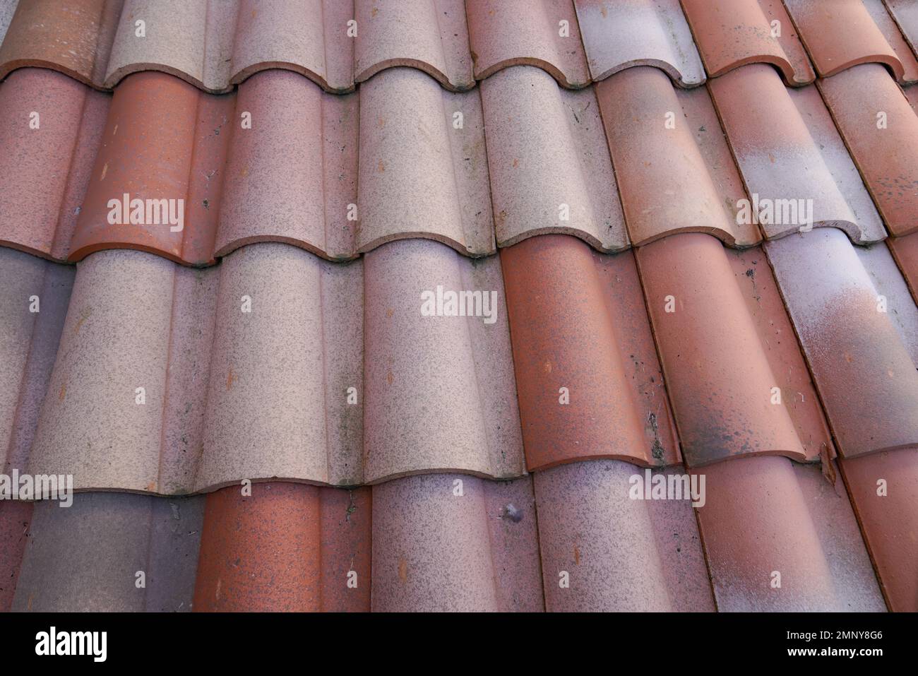 Red roof tiles ceramic shingles on house building as background Stock ...