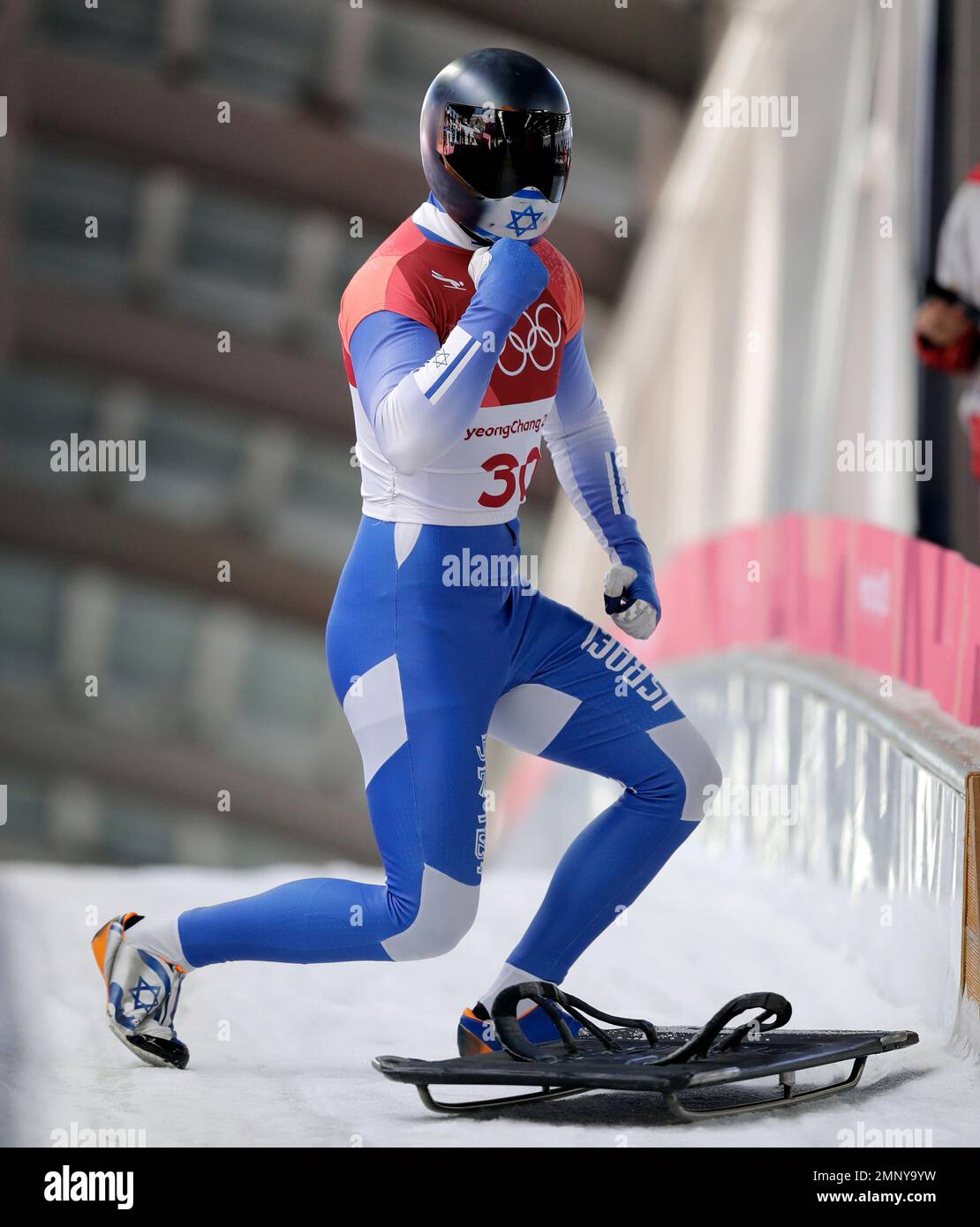 Adam Edelman of Israel brakes in the finish area after his first run ...