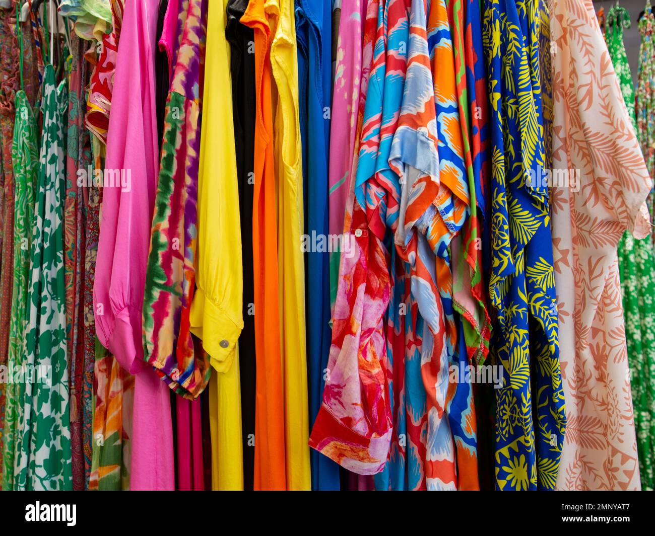 different dresses and patterned fabric shop fashionable background ...