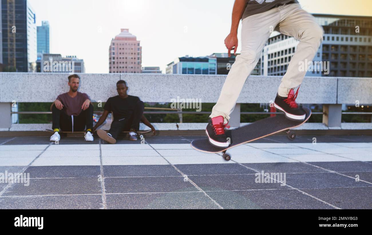 Impossible is nothing. a young man doing tricks on his skateboard while ...