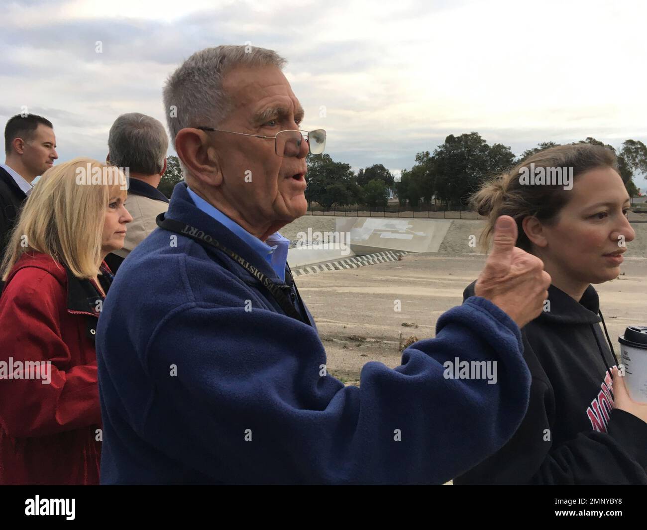 Judge David Carter, a U.S. District Judge, center, walks with Brooke ...