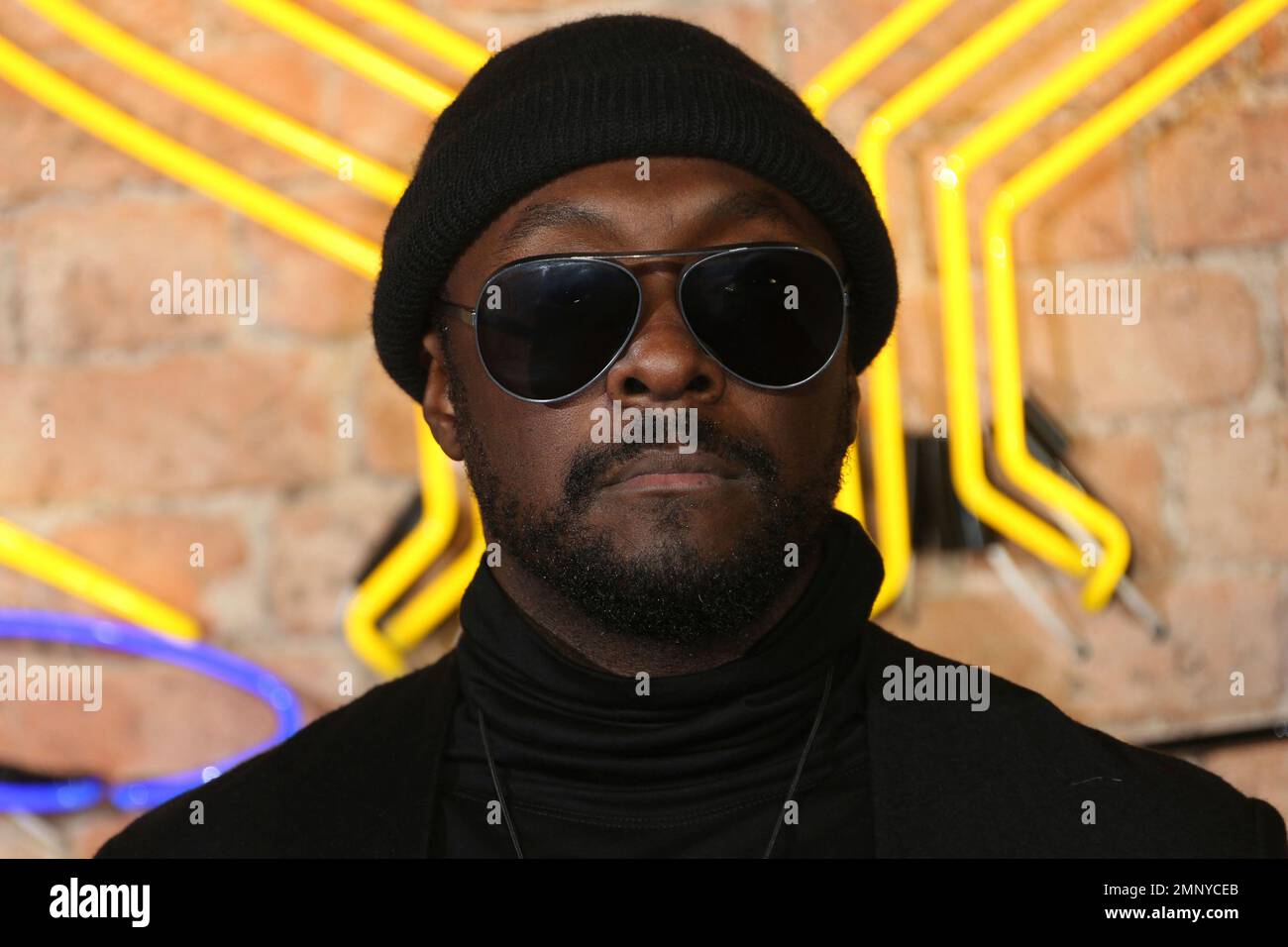 Will.i.am poses for photographers upon arrival at the premiere of the ...