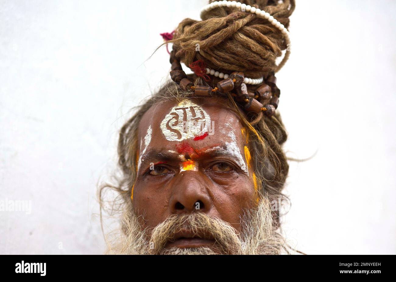A Sadhu or Hindu holy man, written 'Ram', a name of a Hindu lord, on ...