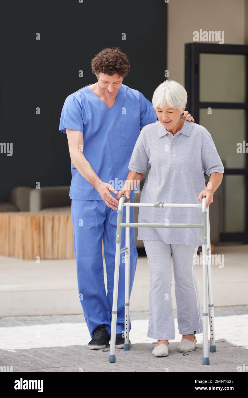 Making great progress with the help of her doctor. a male doctor ...