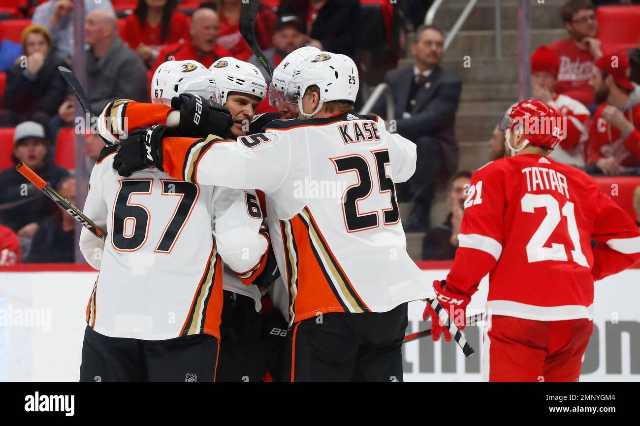 Anaheim Ducks players celebrate an Adam Henrique goal against the ...