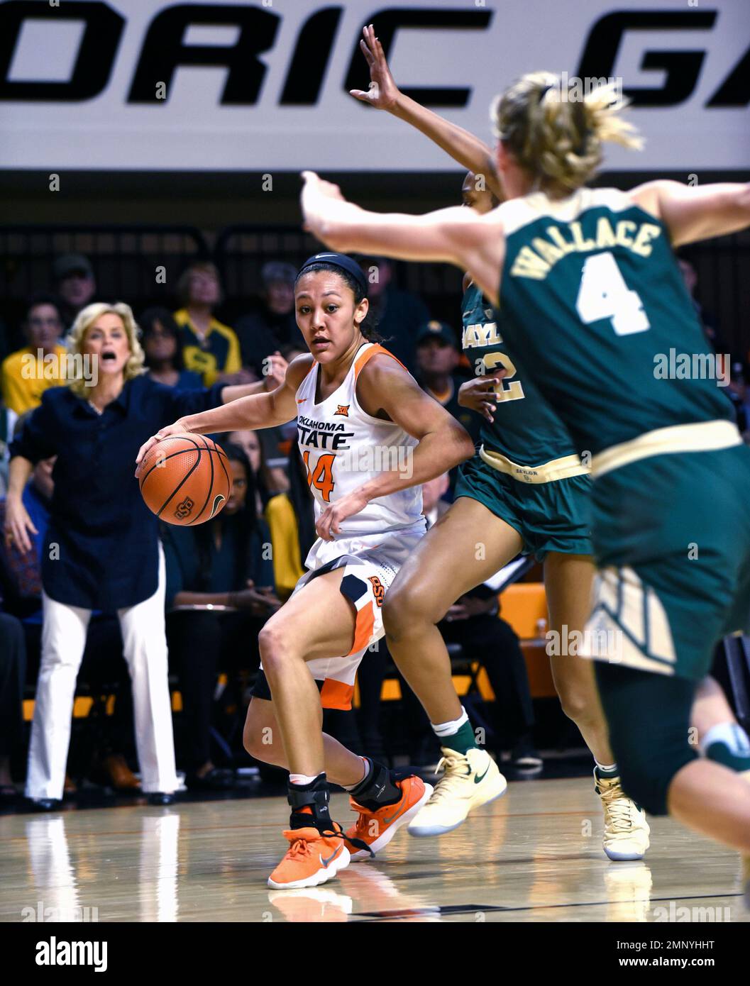 Oklahoma State guard Braxtin Miller, left, drives the ball past Baylor ...