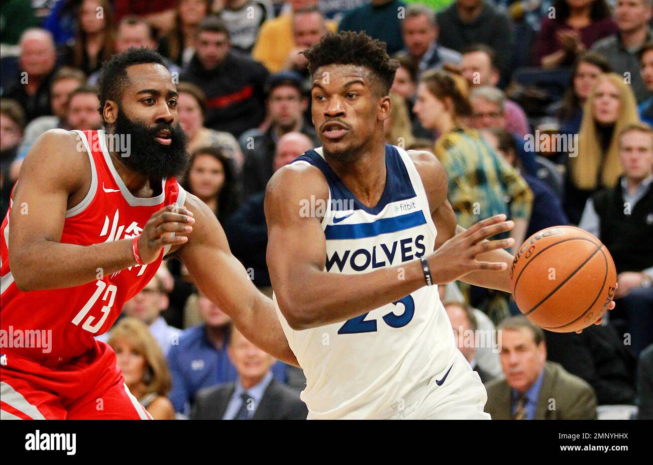 Minnesota Timberwolves' Jimmy Butler (23) drives on Houston Rockets ...
