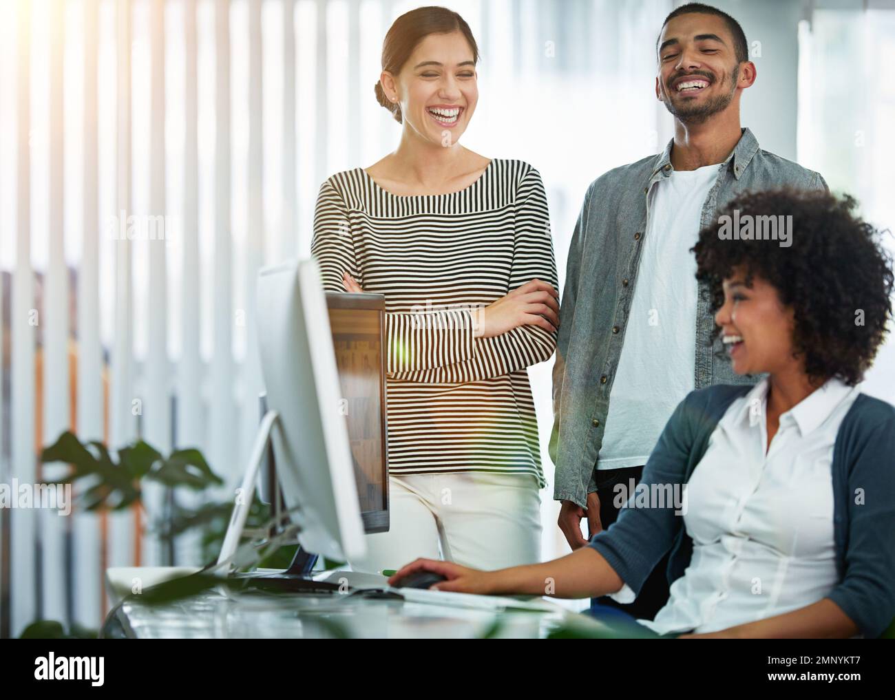 Getting the job done with a smile. Portrait of designers standing ...