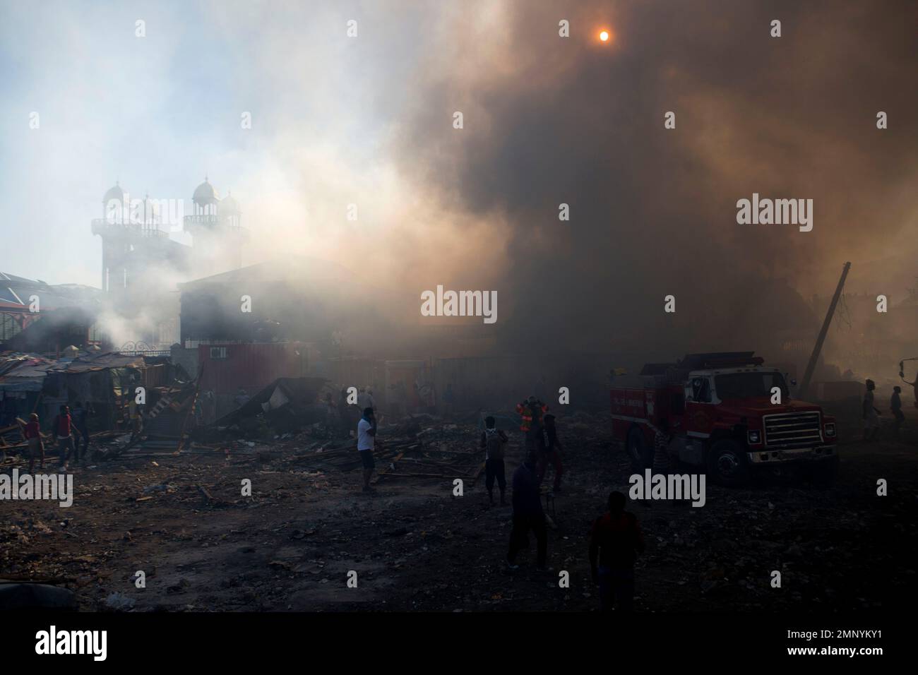 Smoke billows from a section of the Iron Market, also known as Marche ...