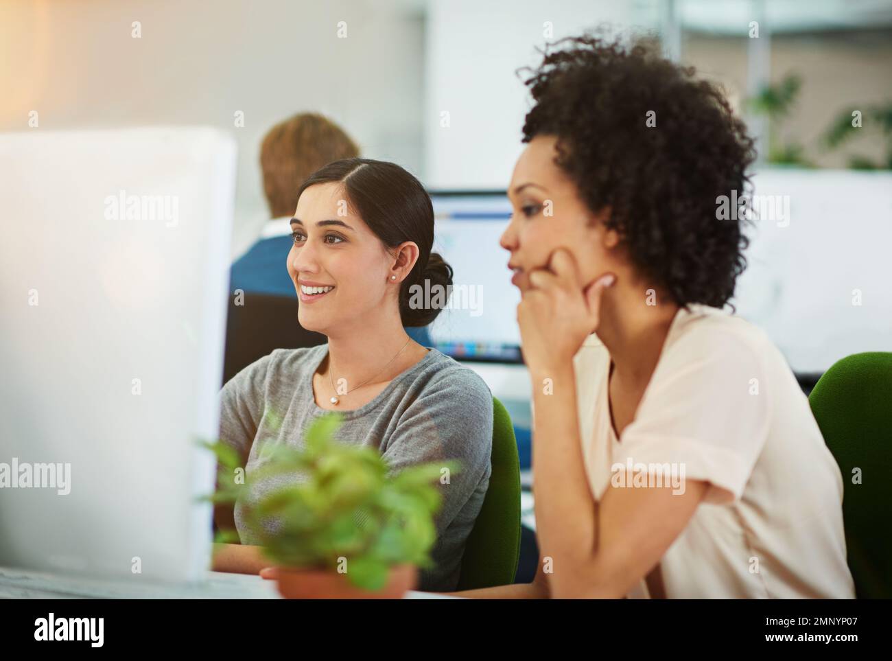 Talking design and enjoying work. two young designers talking together ...