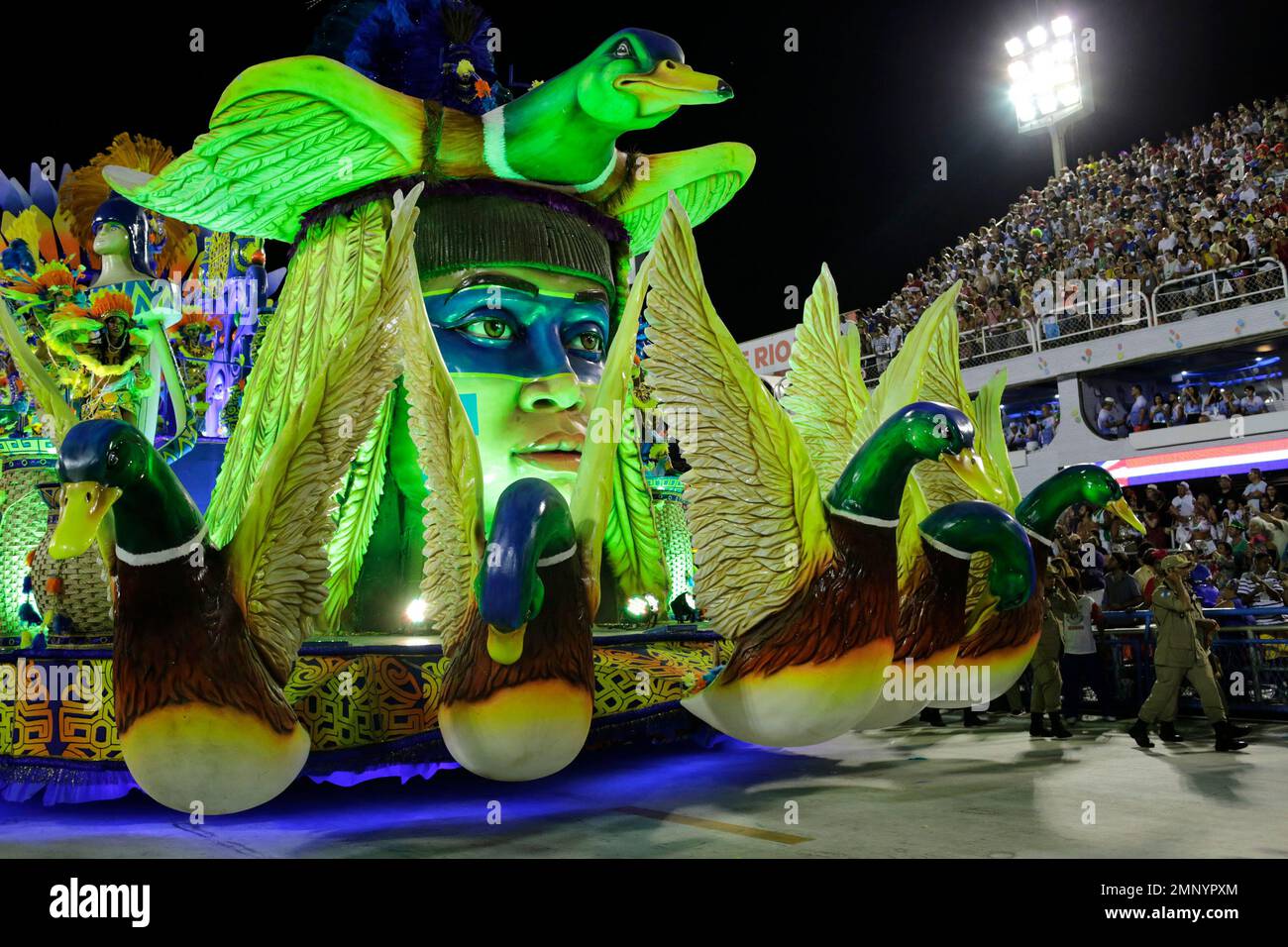 Performers from the Uniao da Ilha school parade on a float during ...