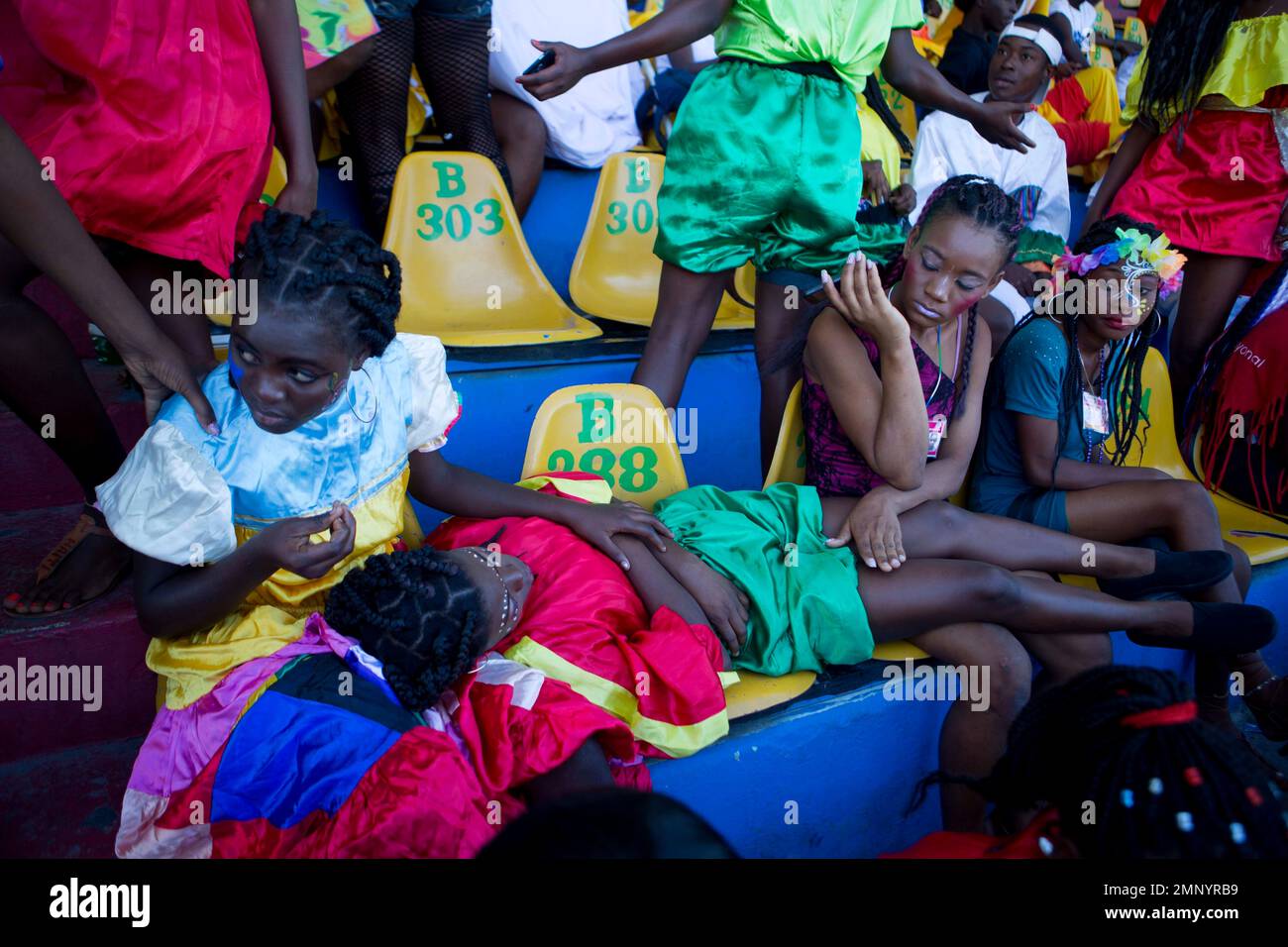 A performer lies down to rest at the National Stadium before the start ...