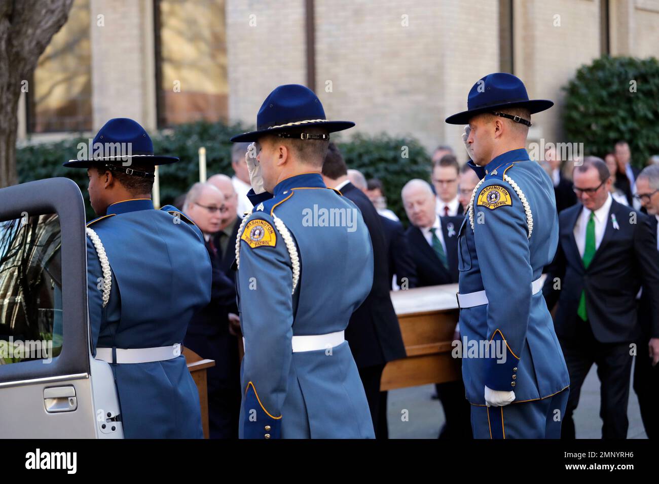 A Washington State Patrol honor guard salutes the casket of former Gov ...