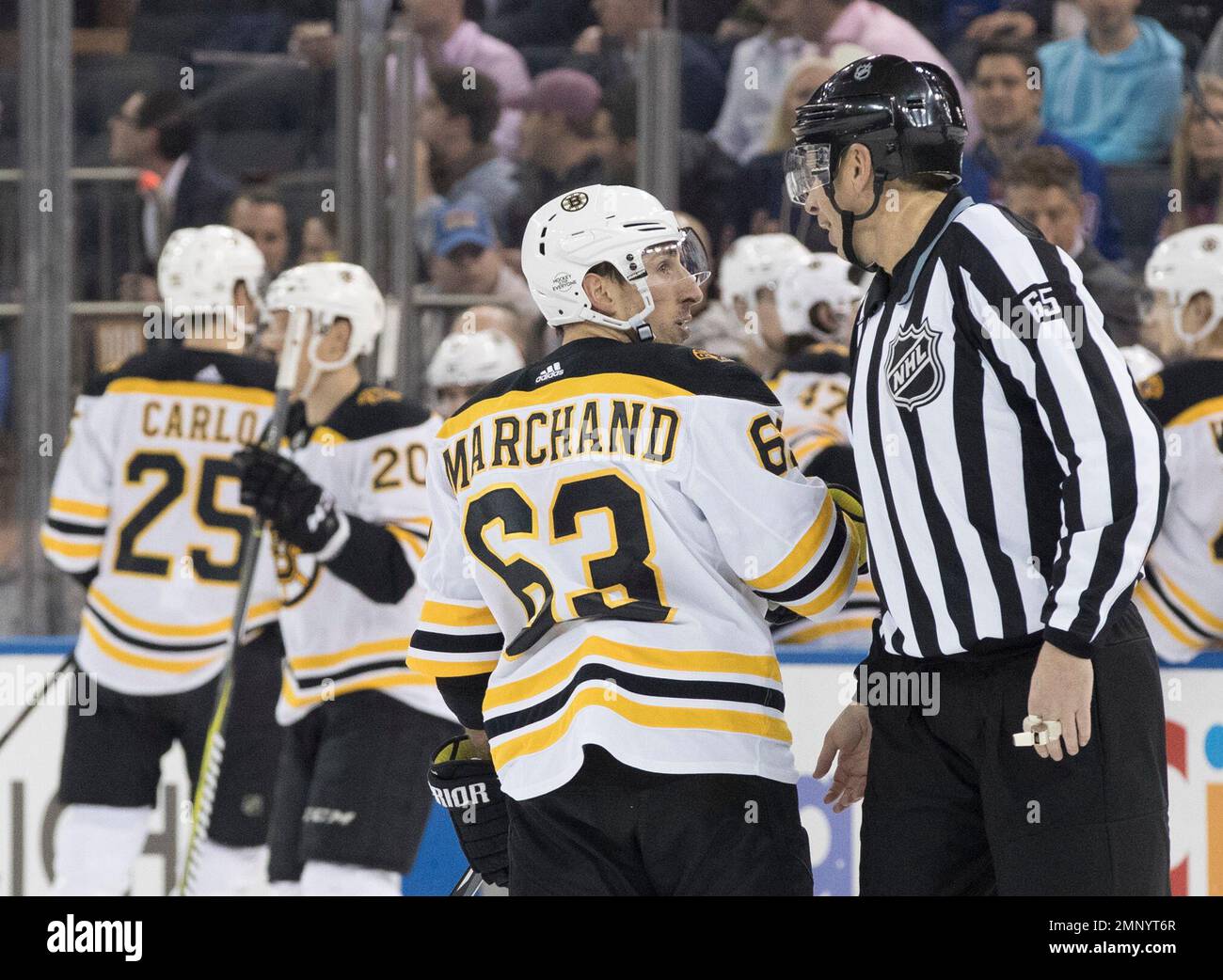 Boston Bruins left wing Brad Marchand talks to linesman Shane Heyer (55 ...