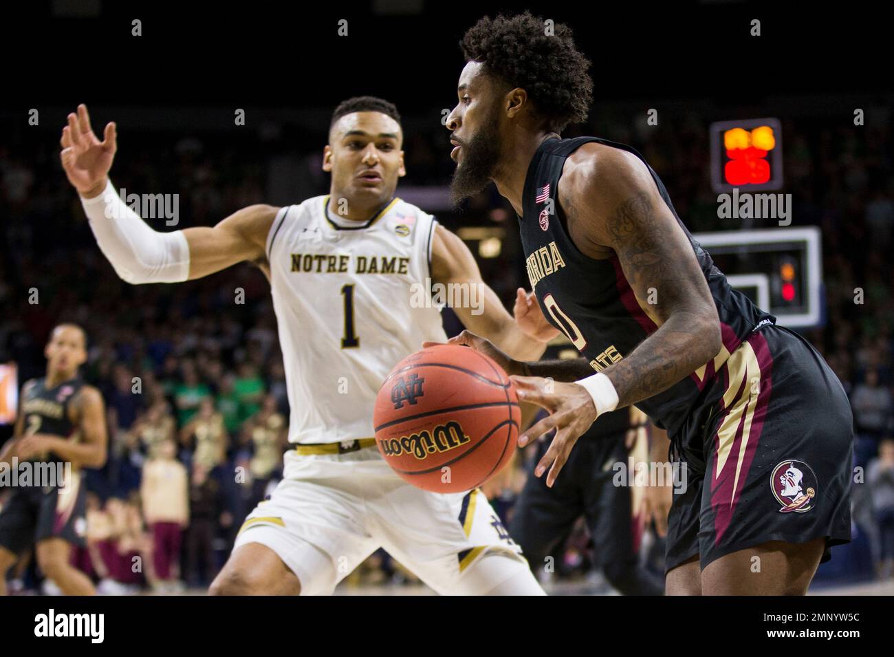 Florida State's Phil Cofer (0) drives bt Notre Dame's Austin Torres (1 ...