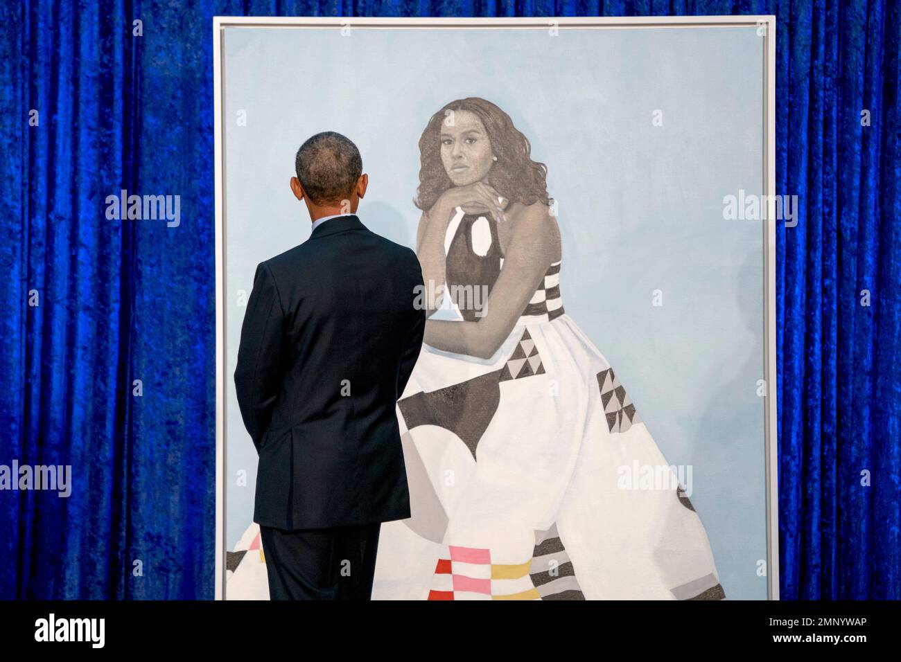 Former President Barack Obama, looks at former first lady Michelle ...