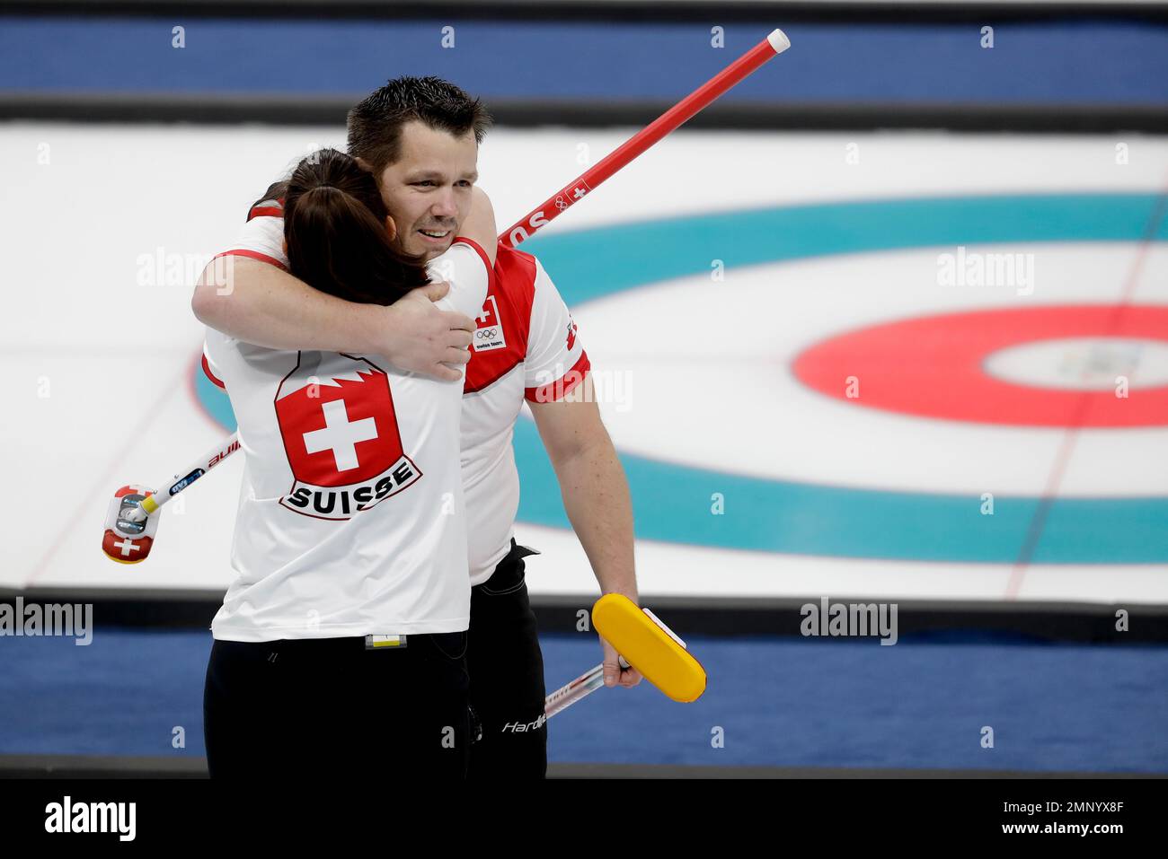 Switzerland Jenny Perret, left, and Martin Rios celebrate winning the ...