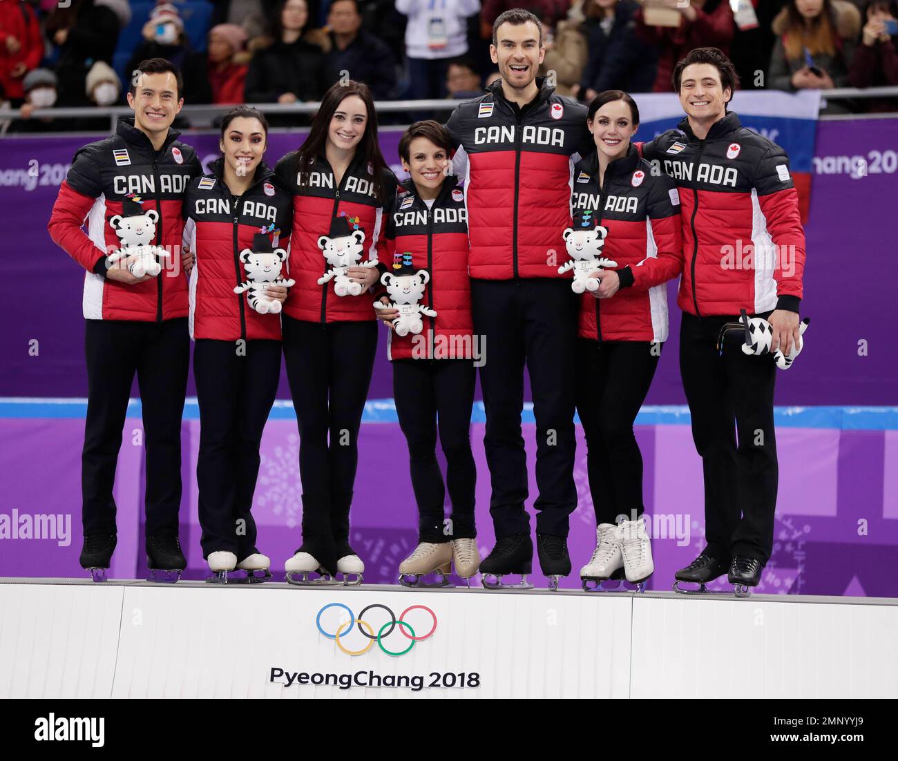 The Canadian team celebrate on the podium during the Venue Ceremony ...